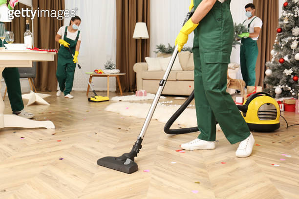 Cleaning service team working in messy room after New Year party 이미지 ...