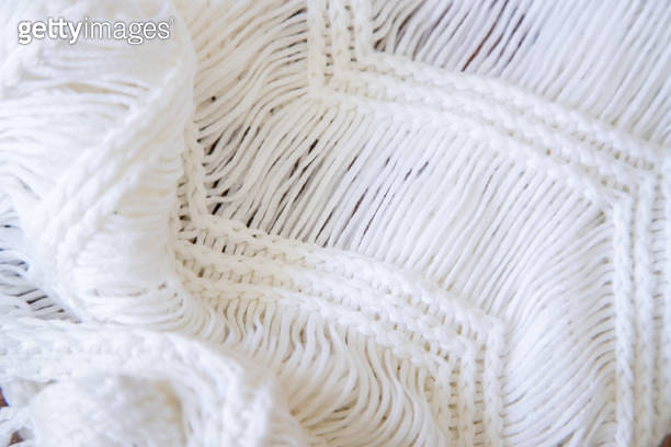 Background made with white knitted fabric threads making a nice and ...