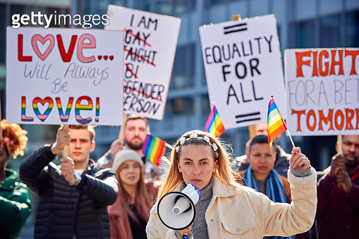 Group Of Protestors With Placards And Megaphone On Demonstration March ...
