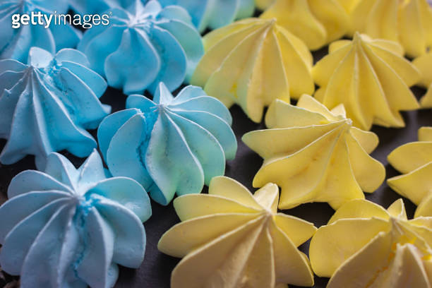Colorful meringue. Blue and yellow meringue. Ukrainian national colors ...