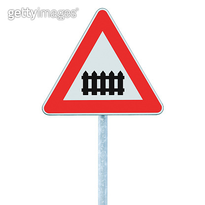 Railroad level crossing with railway barrier or gate ahead road sign ...