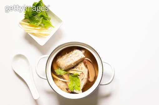 Pot of soup with sea bass fish and herb, healthy meal. Overview shot ...