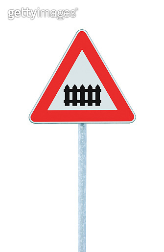 Railroad level crossing with railway barrier or gate ahead road sign ...