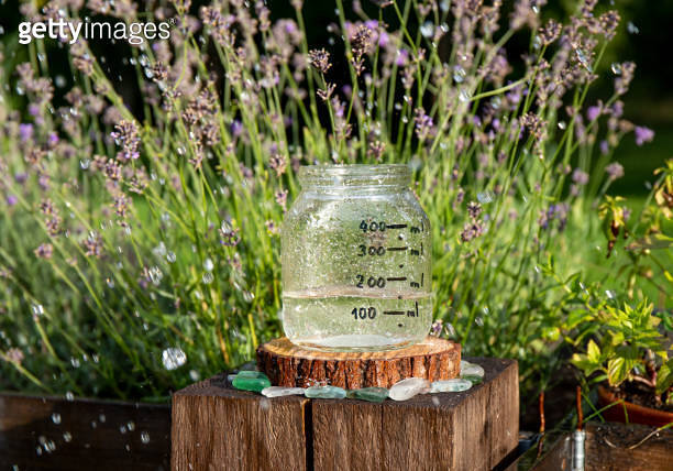 Handmade rain water gauge made of glass jar, measuring rain in home ...