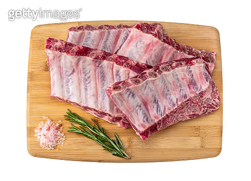 Raw pork ribs. Arrangement on cutting board. Chop Ribs. Pork belly ribs ...