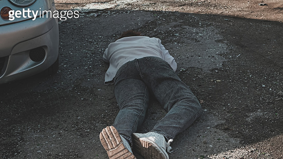 a young teenage girl was hit by a car . lying like a dead corpse on the ...