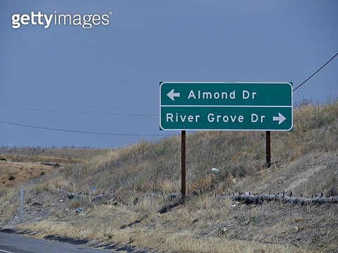 Roadside signs along Highway 46 with directions to Almond Drive adn ...