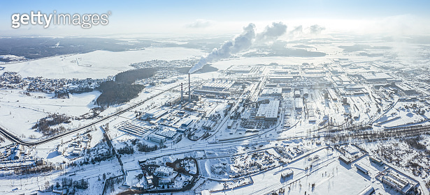 suburban industrial district in winter. factory buildings, warehouses ...