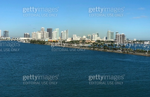 Wide shot of Miami coastline with high-rise buildings in the background ...