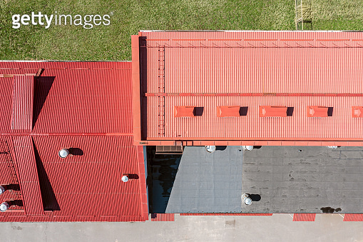 red metal roofing of industrial building. corrugated metal roof with ...