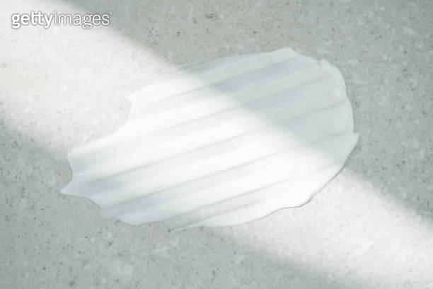 Sample of cream smear under sunlight. White cream or body lotion ...