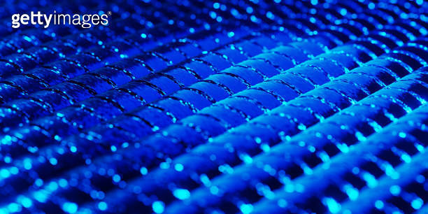 Glittering shiny futuristic blurred metallic chrome ribbons. Blue tiles ...