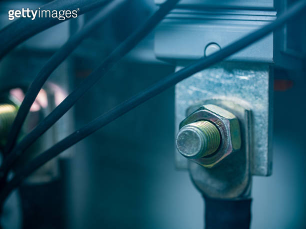 Close-up from connection of a high-voltage electricity cable, screwed ...