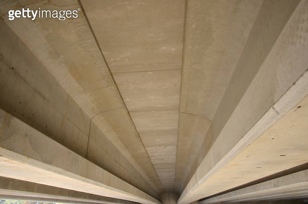 concrete highway bridge. looking at the bottom of the bridge is ...
