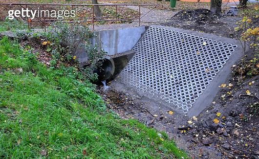 a stream that cobbled into a narrow channel. the upper side is made of ...