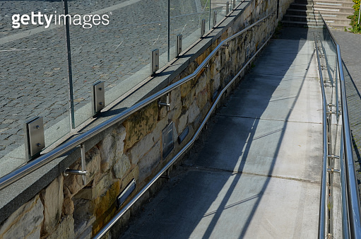 metal railings stairs and ramps for wheelchairs. The ramp is used for ...