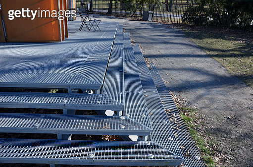 metal stairs are wide and transparent. made of stainless steel grid ...