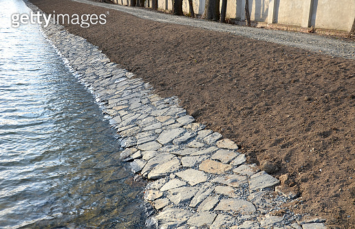 Bridge over safety spillway of the dam. stone bridge with natural ...