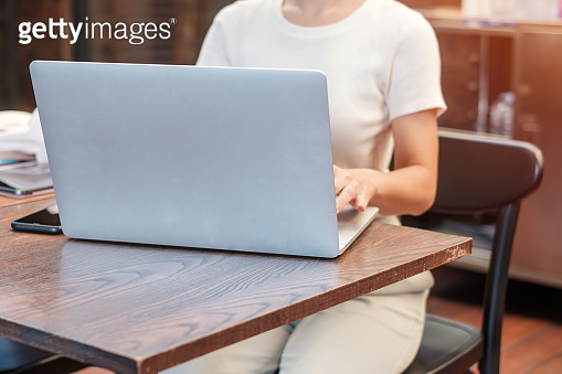 Casual Businesswoman using laptop, freelance woman typing keyboard ...