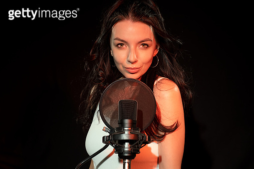 Portrait of an Emotionally Female Talented Singer looking at camera ...