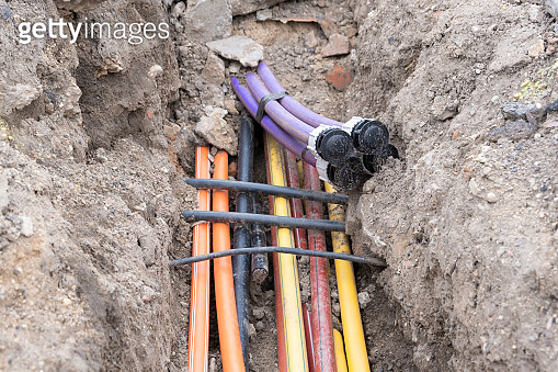 Electric cable underground. Broadband and power Lines in various colors ...