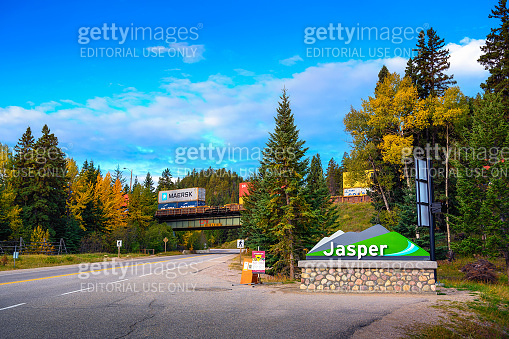 Welcome sign to the village of Jasper located within the Canadian ...