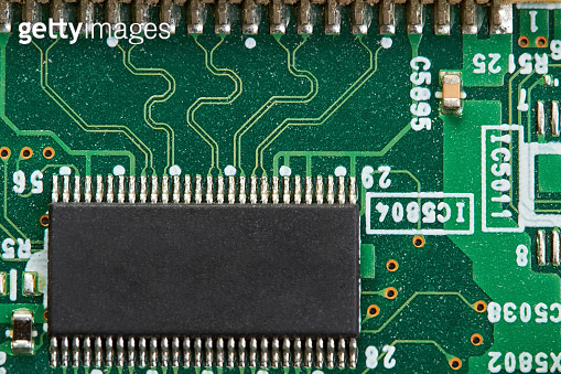 Close-up of computer chip on a part of electronic printed circuit board ...