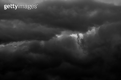 Dark sky and dramatic black cloud before rain.A tropical cyclone is a ...