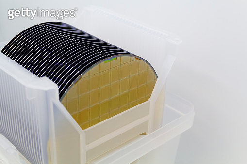 Close up of Silicon wafers gold yellow color with chip cells prepared ...
