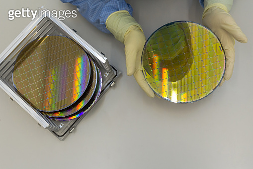 Silicon Wafers in steel holder box take out by hand in gloves- A wafer ...