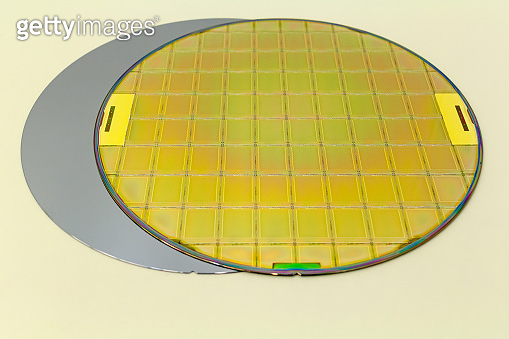Silicon Wafers two types -empty grey wafer and gold wafes with ...