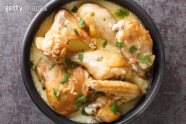 Shkmeruli is a traditional Georgian dish made with fried chicken slowly ...