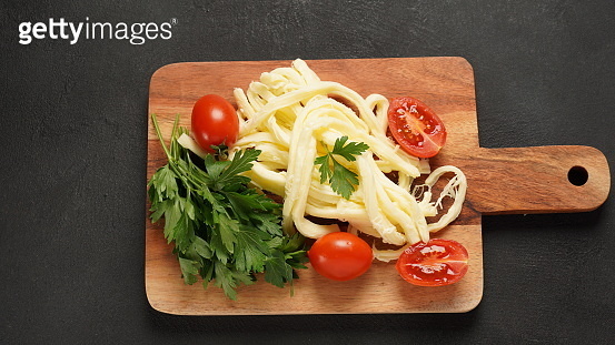 String cheese or cheese whip - salty snack cheese with cherry tomatoes ...