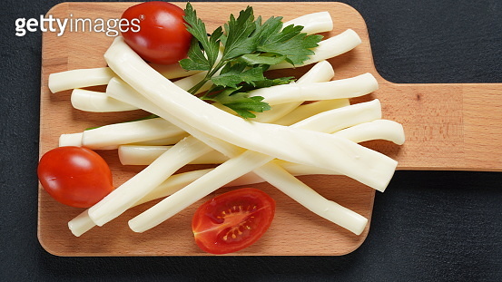 String cheese or cheese whip - salty snack cheese with cherry tomatoes ...