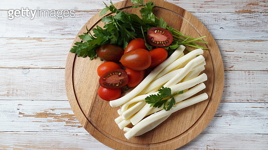 String cheese or cheese whip - salty snack cheese with cherry tomatoes ...