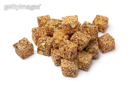 Heap of Turkish delight with sesame seed and pistachio nuts close up ...