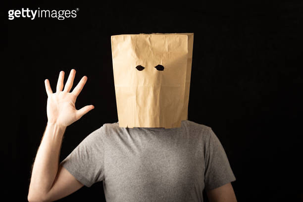 man wearing a paper bag over his head and holding up five fingers 이미지 ...