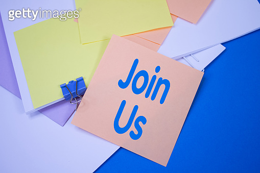 Join Us. Text on adhesive note paper. Event, celebration reminder ...
