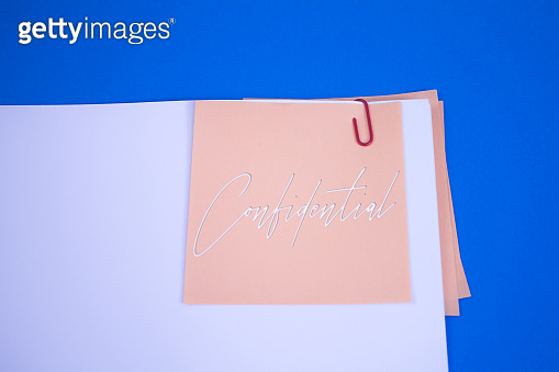 Confidential. Text on adhesive note paper. Event, celebration reminder ...