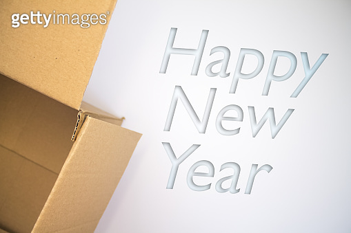 Happy New Year word with cardboard box. Brown folded card box. 이미지 ...
