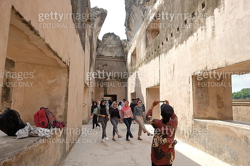 Domestic tourists visit and take pictures at Pulo Cemeti's historic ...