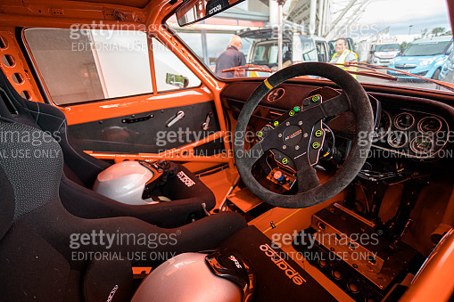 The interior of a a classic rally car, an orange Ford Escort mk1 Mexico ...