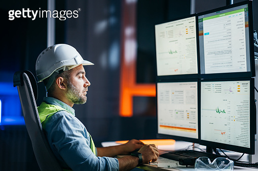 Bearded engineer follow of product line on modern factory. Operator ...