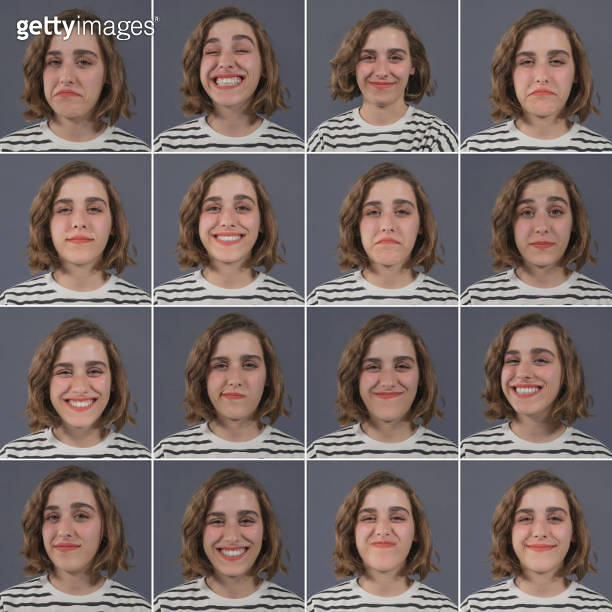 A young woman trying to give pozes with different types of facial ...