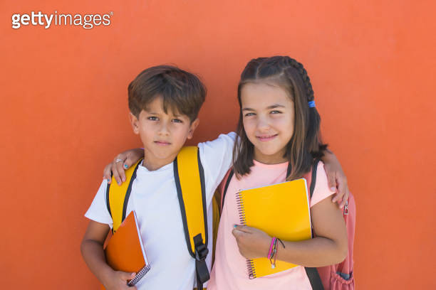 Elementary age children with facial expression of joy on the first day ...
