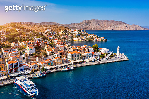 Aerial view of the beautiful greek island of Symi (Simi) with colourful ...