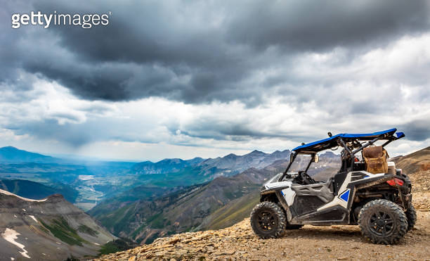 Side by side UTV ATV RZR with Mountain range in the background at the ...