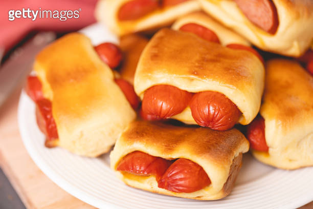 Hot dog baked with bread dough (Syrian hot dog) or sausage roll in ...