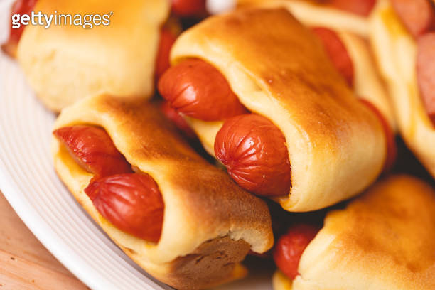 Hot dog baked with bread dough (Syrian hot dog) or sausage roll in ...