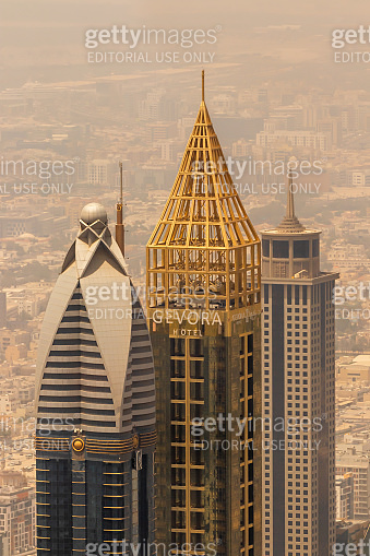 Skyline of Dubai with the golden rooftop of the Gevora hotel ...